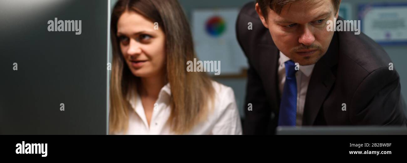 Employees work hard at computers, solving problem Stock Photo - Alamy