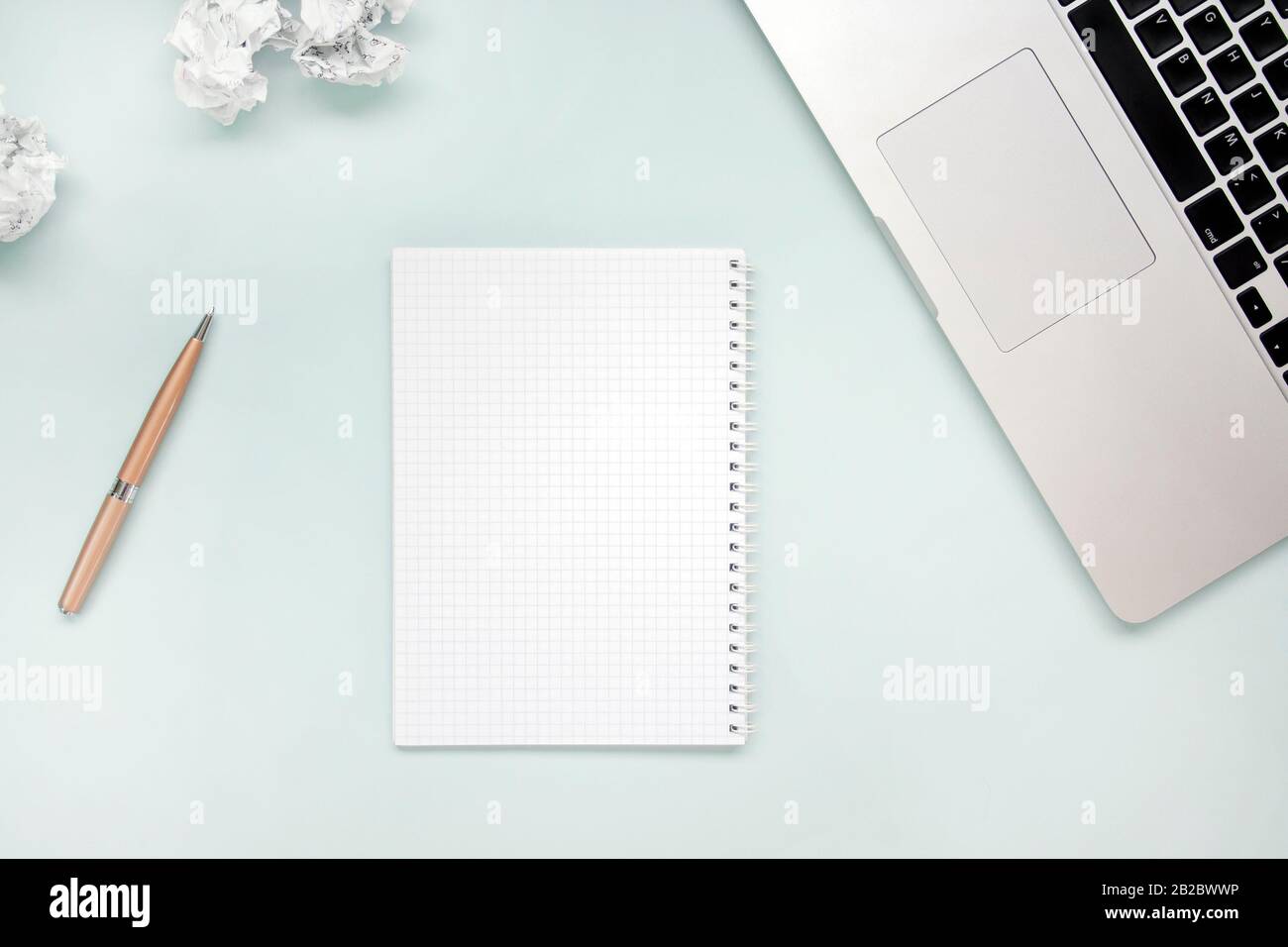 Work and creativity concept. Laptop, notepad, crumpled paper and pen ...