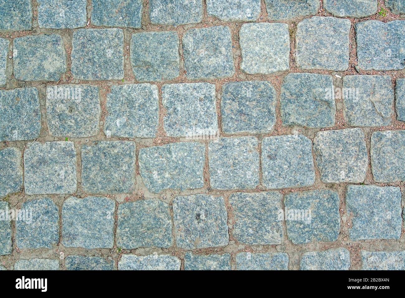 Old aged granite paving stones. Texture of old granite paving stones ...