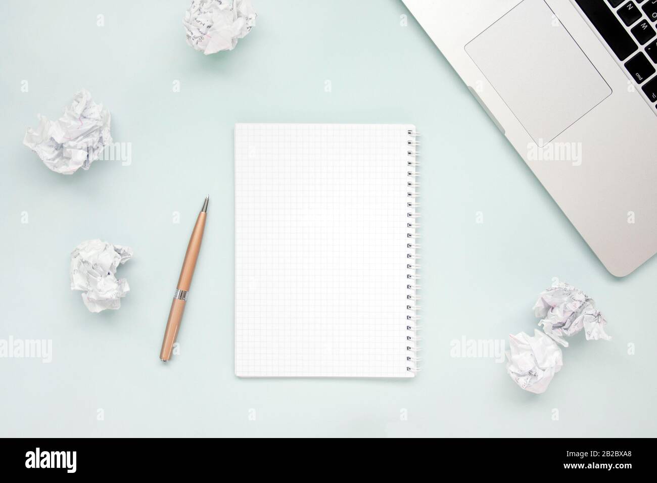 Work, creativity concept. Laptop, notepad, crumpled paper and pen top ...