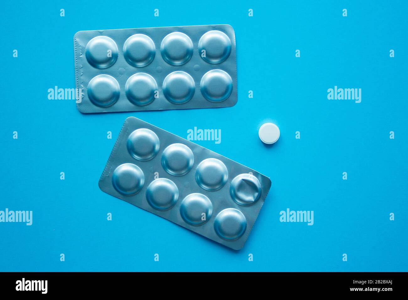 Some medical blisters and 1 pill top view. Medical concept of treatment ...