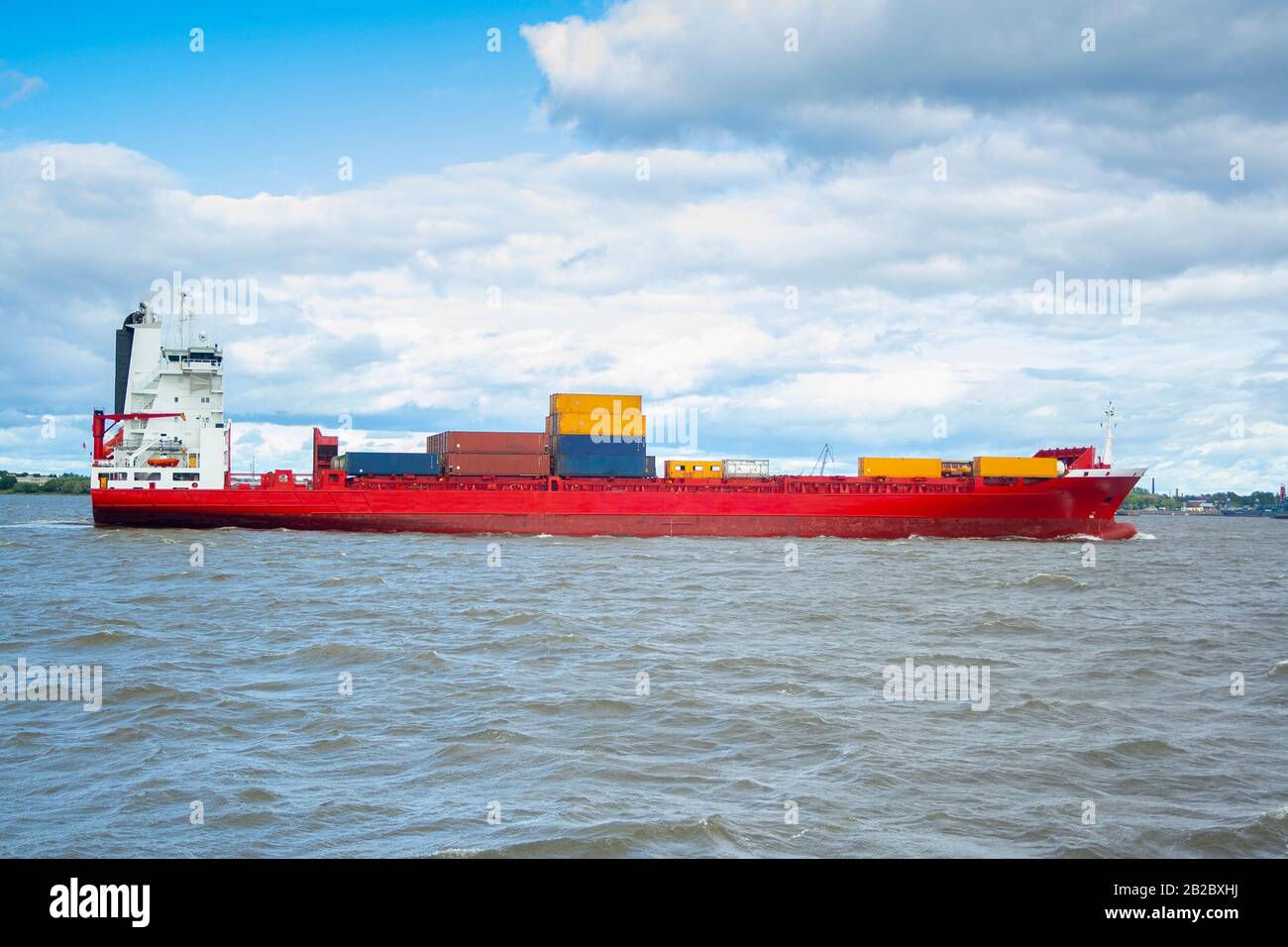 huge red barge with large containers on board. shipping cargo ...