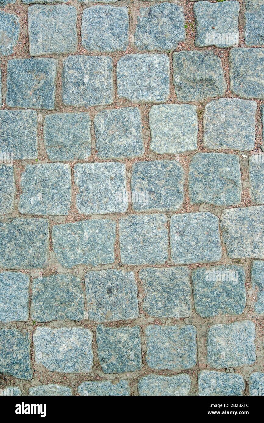 Old aged granite paving stones. Texture of old granite paving stones ...