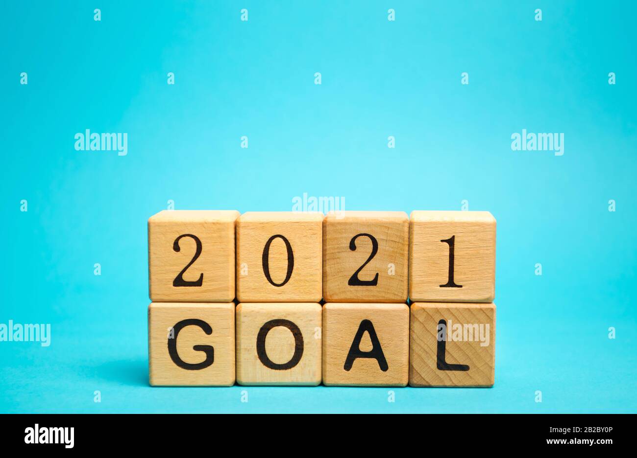 Wooden blocks with the inscription 2021 goal. The concept of achieving ...