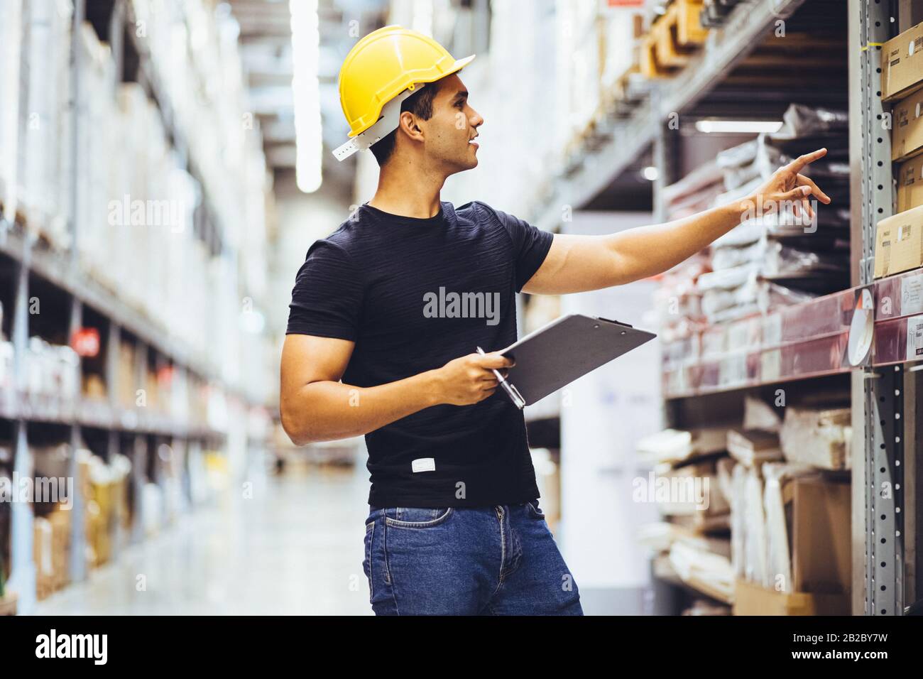 Smart Indian engineer man worker wearing safety helmet doing ...