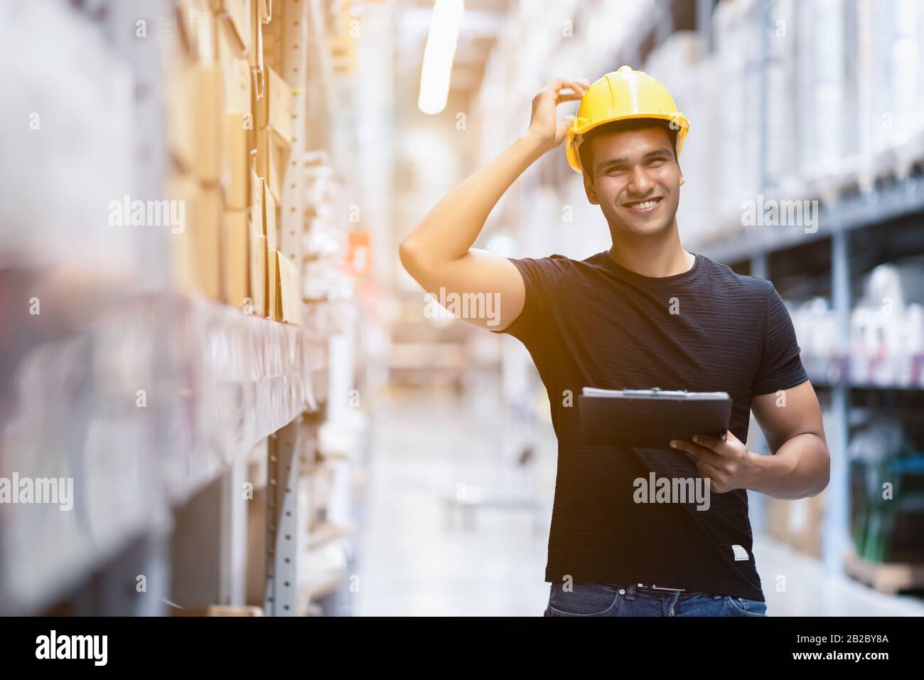 Smart Indian engineer man worker wearing safety helmet doing ...