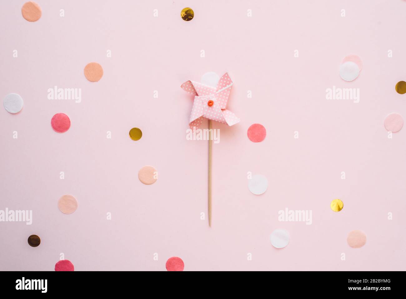 Children's pastel weather vane topper for a cupcake on a pink ...