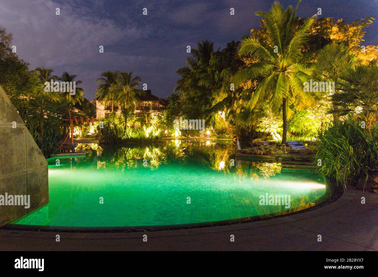 Luxury hotel with pool at night Stock Photo - Alamy