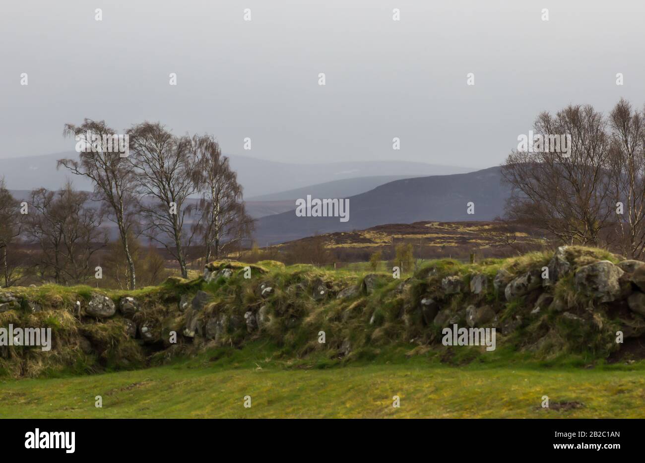 A grass covered drywall just outside Newtonmore, Scotland, with the ...