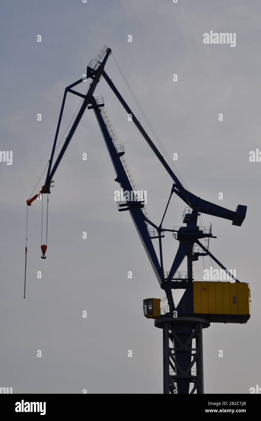 photographic illustration of a huge mechanical crane Stock Photo - Alamy