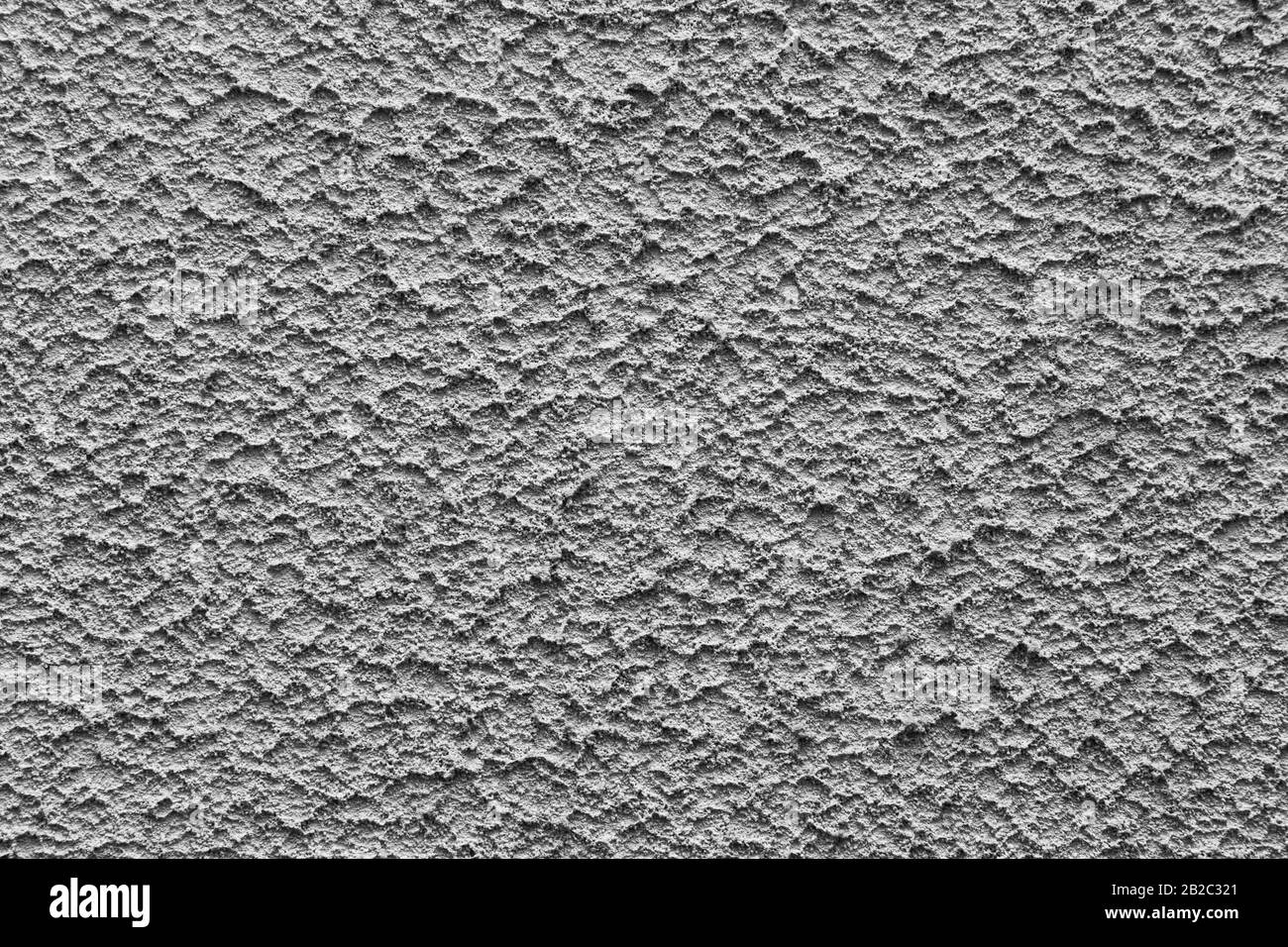 Rough gray wall painted with plaster, close up. Texture of rough ...