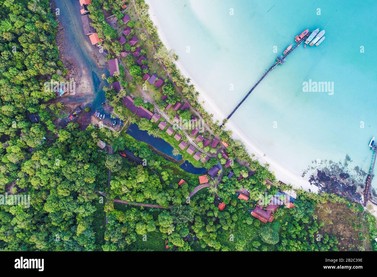 Aerial sea view of beautiful curve beach with wooden pier blue ocean ...