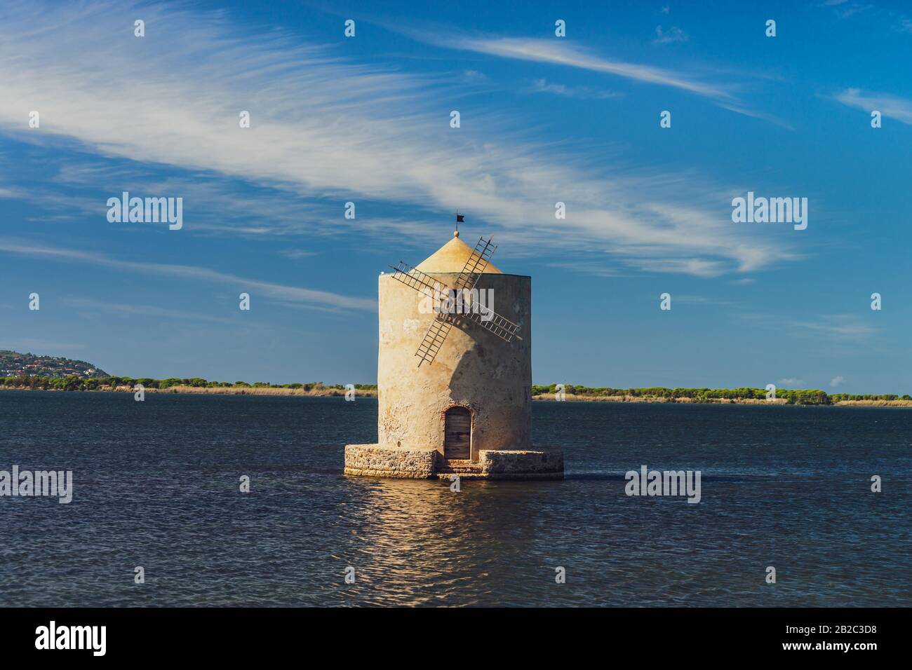 Old windmill in italy, tuscany. Standing in the water, summer Stock ...