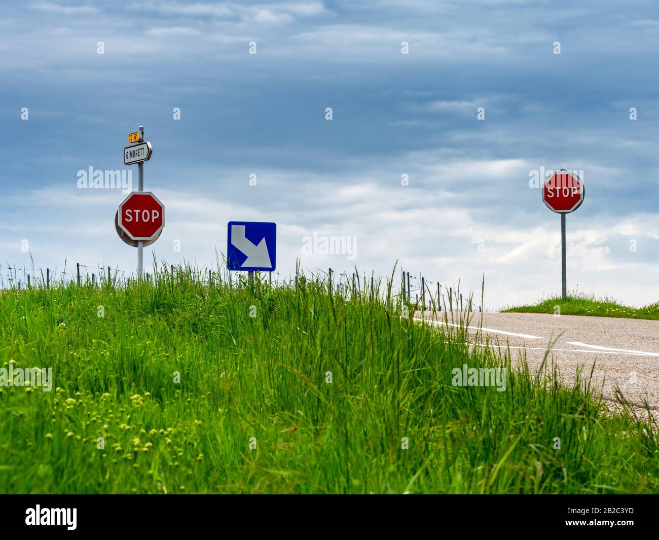 Crossroads of asphalt roads in a clean floor. Green grass and road ...