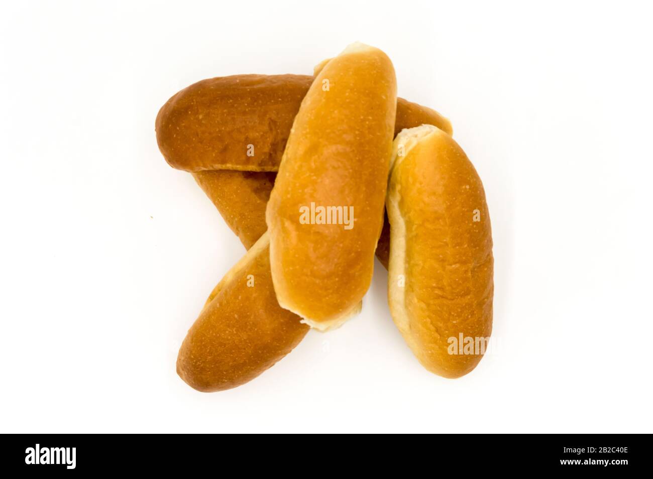 Lying buns lay in heap top view on a white background Stock Photo - Alamy