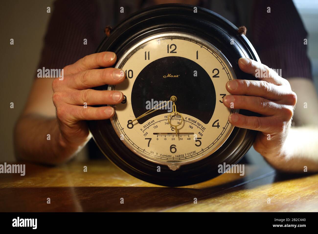 Men's hands hold a watch Stock Photo - Alamy
