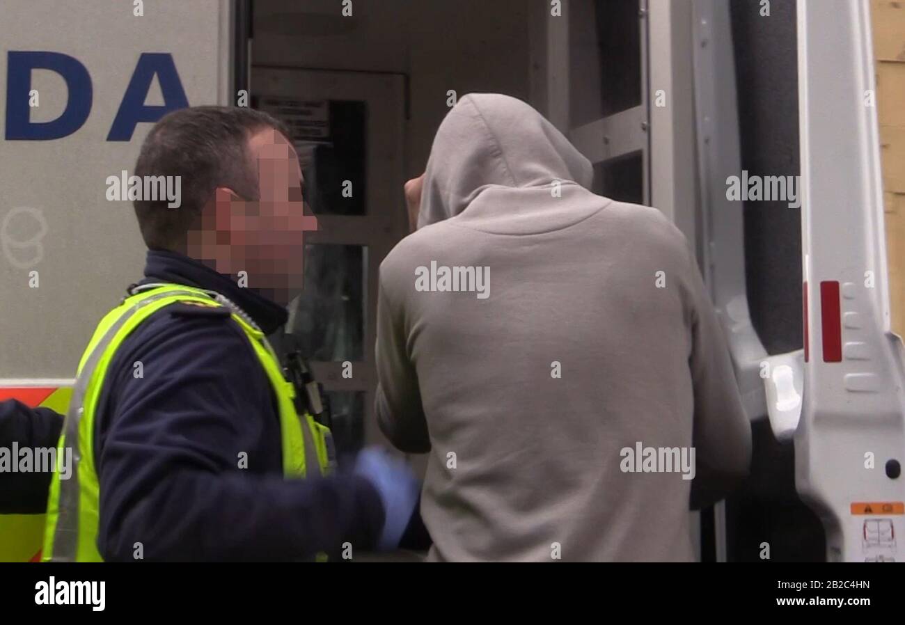 FACES PIXELATED BY PA PICTURE DESK Keith Lennon being escorted from ...