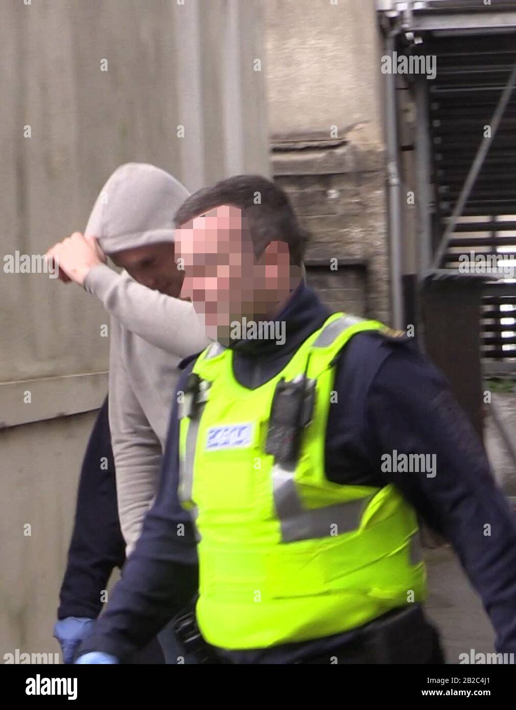 FACES PIXELATED BY PA PICTURE DESK Keith Lennon being escorted from ...
