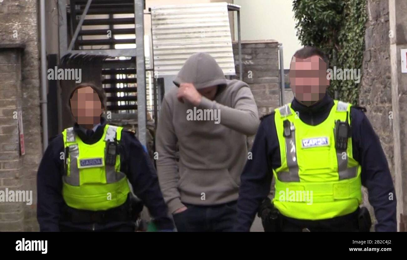 FACES PIXELATED BY PA PICTURE DESK Keith Lennon being escorted from ...