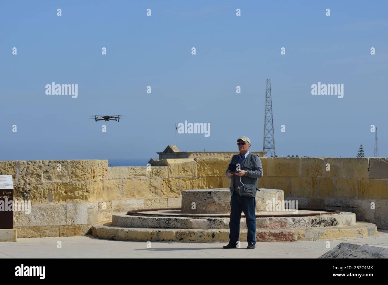 A man flying a drone in Malta Stock Photo - Alamy