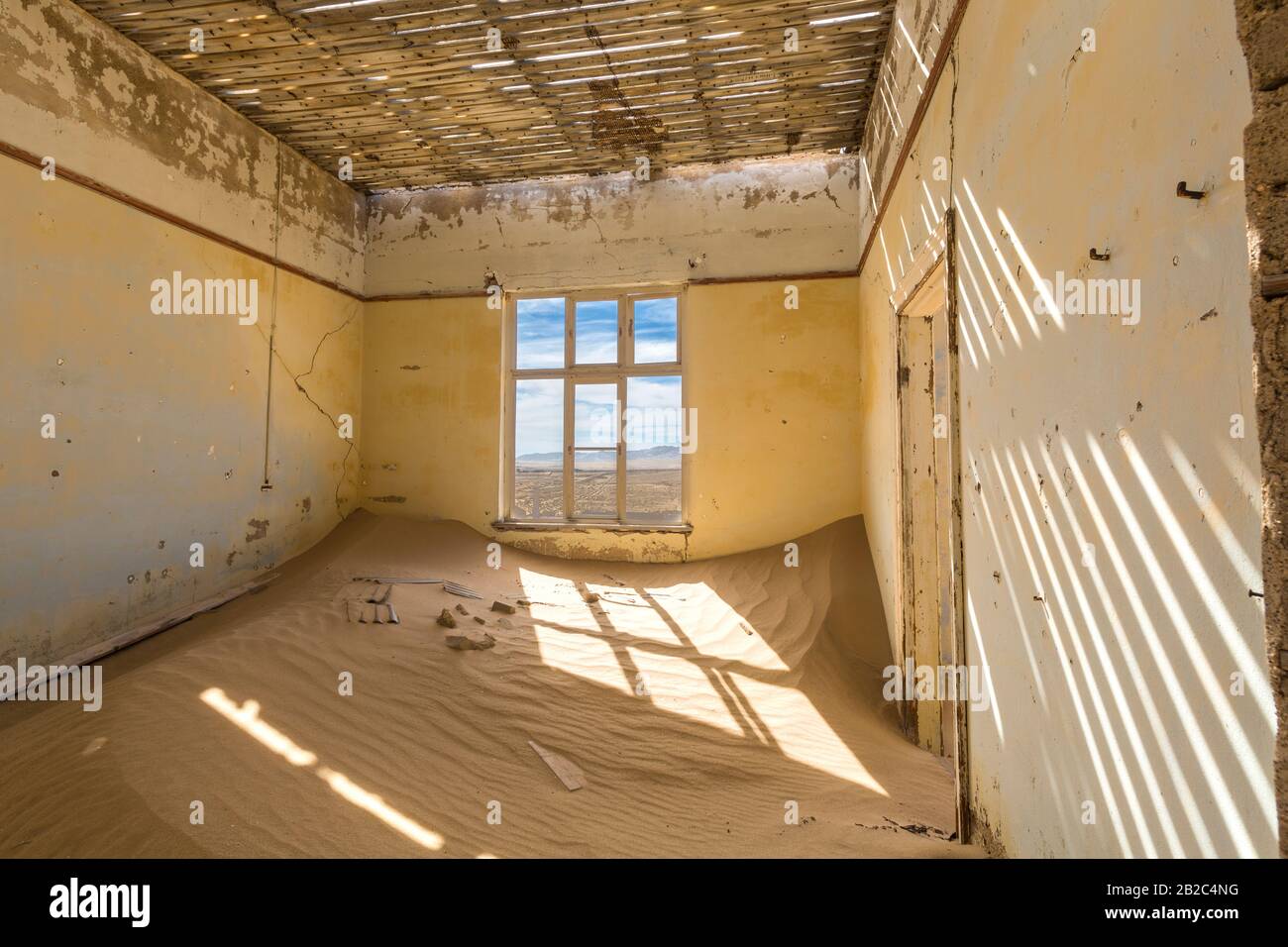 Sunshine through the window on the sand Stock Photo - Alamy