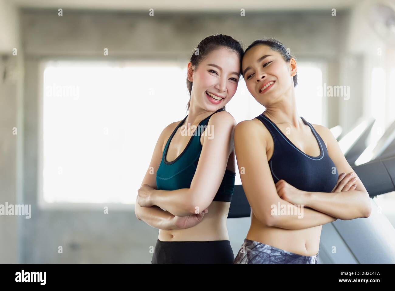 Group attractive asian woman stretching the muscles and relaxing after ...