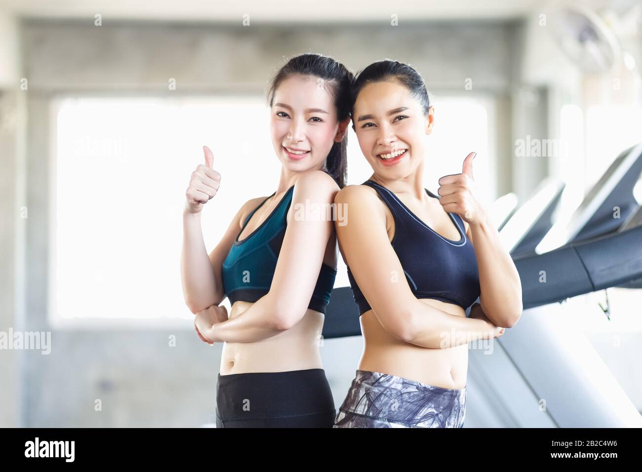 Group attractive asian woman stretching the muscles and relaxing after ...