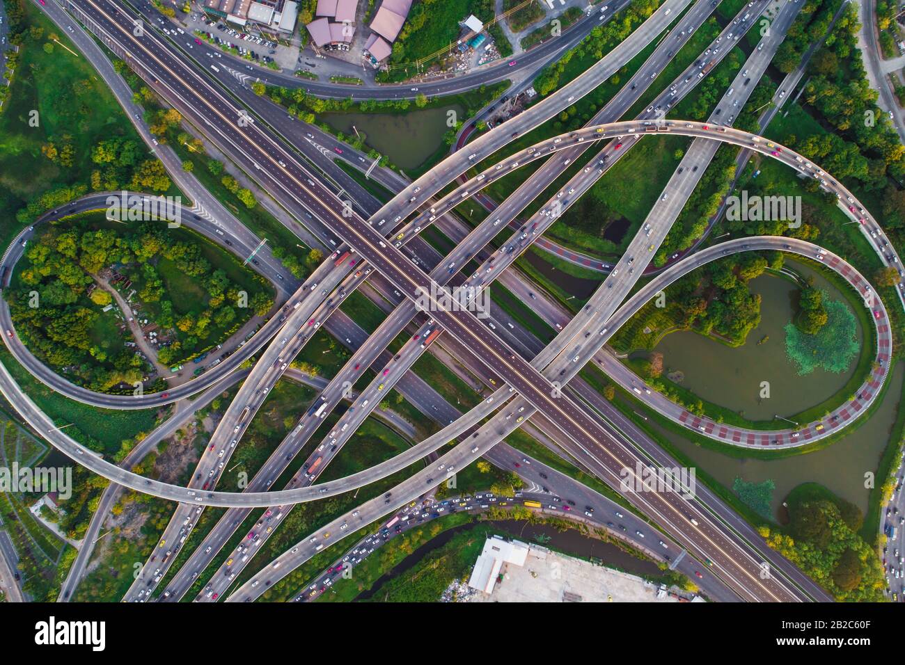 Intersection infinity sign traffic road with car and green park pond ...