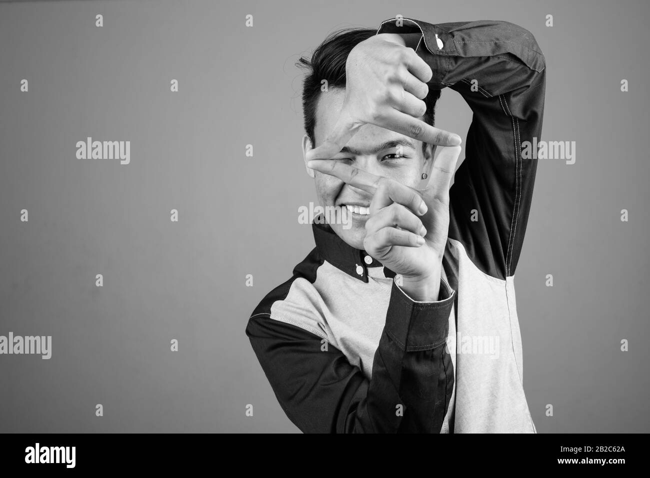 Portrait of young handsome Asian teenage boy looking smart Stock Photo ...