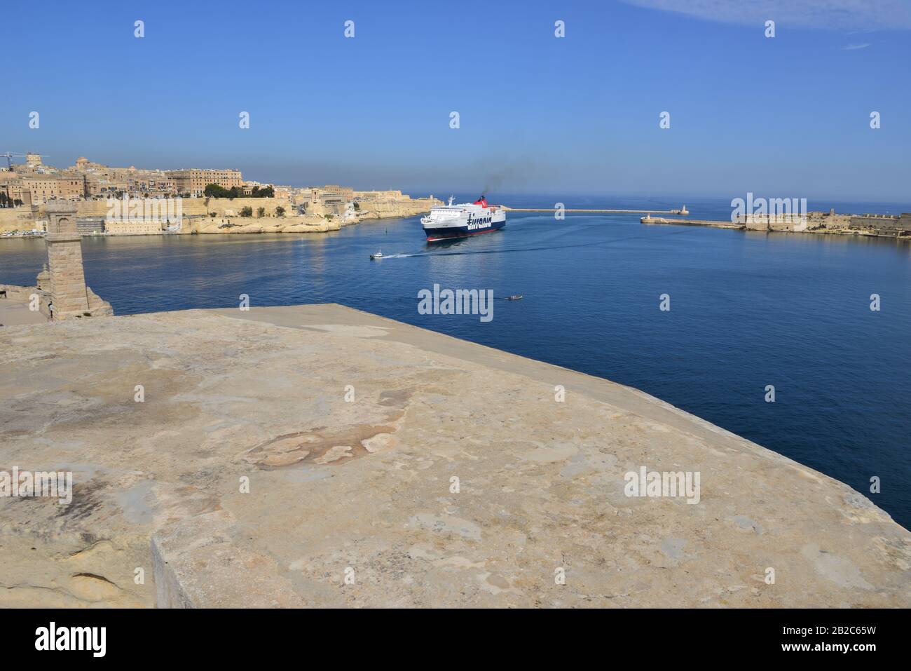 A small cruise liner ferry entering the Grand Harbour in Malta in ...