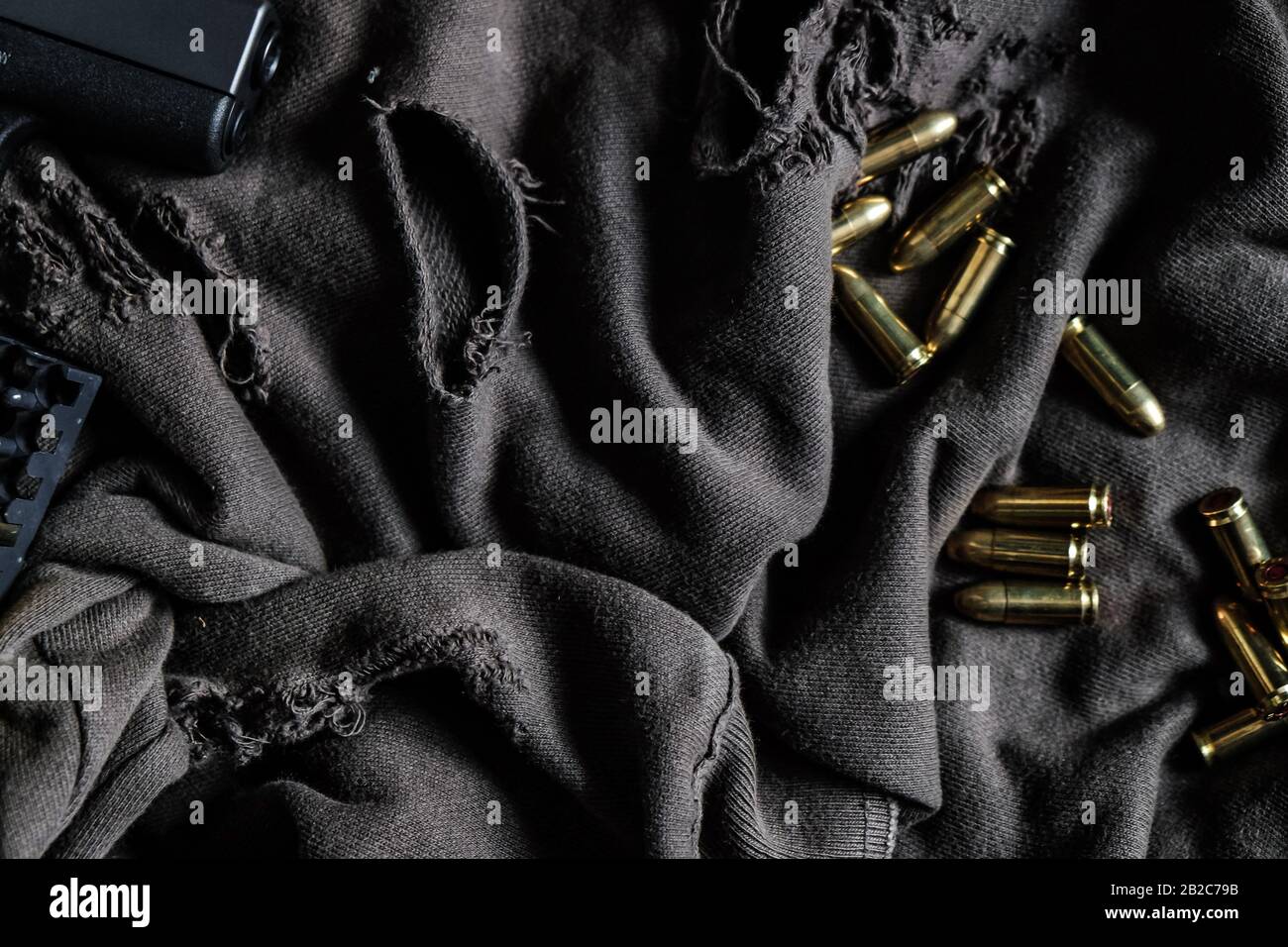 Full metal jacket 9mm ruger bullet on cloth texture arm object Stock ...