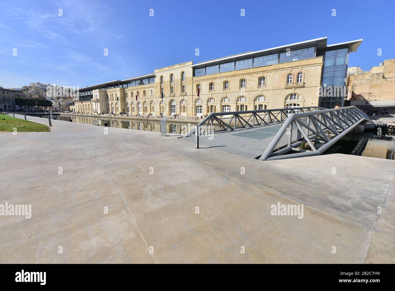 A Lattice framed bridge in front of a an old harbour at Bormla in Malta ...