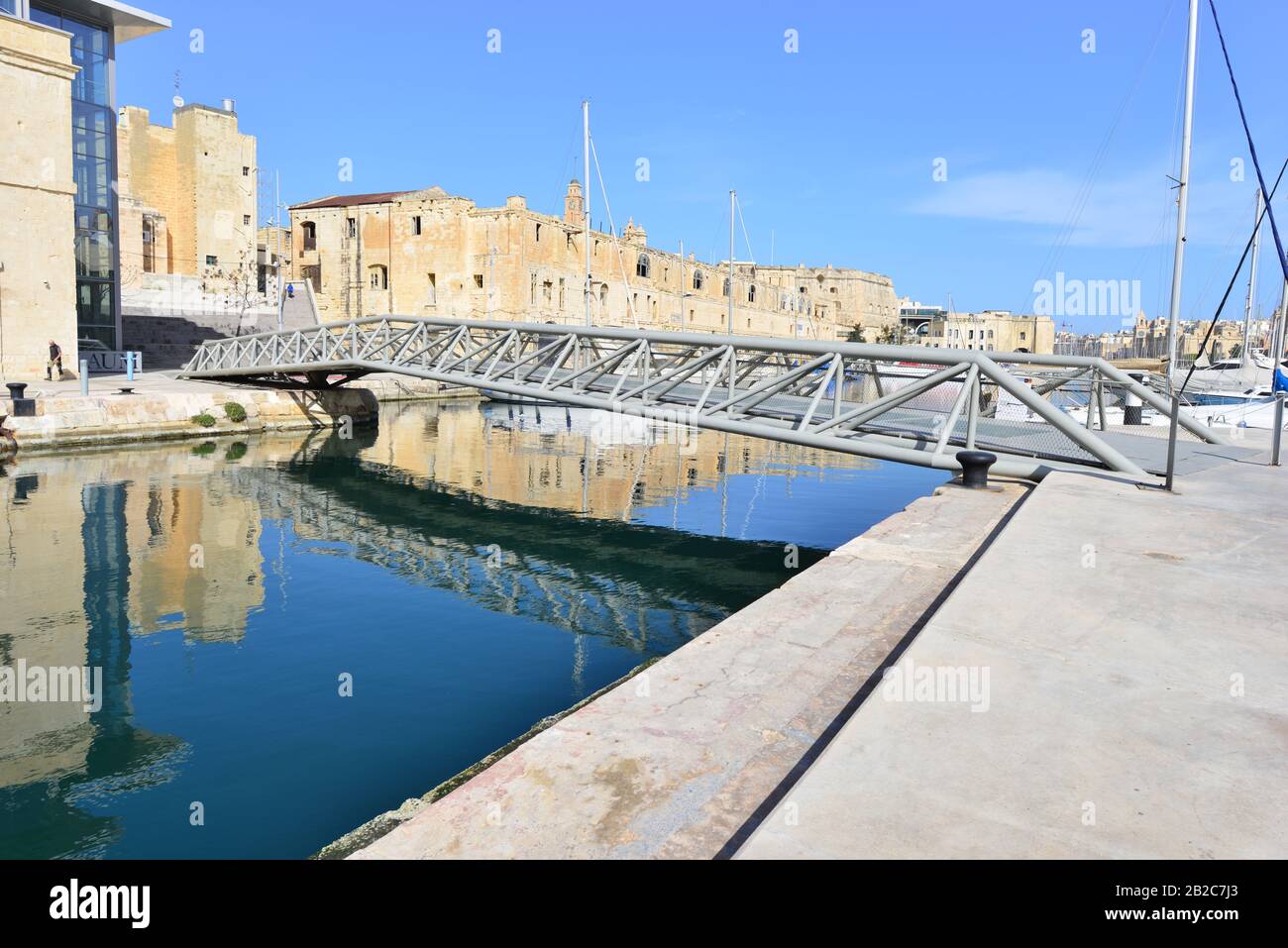 Lattice framed bridge in front of a an old harbour at Bormla in Malta ...