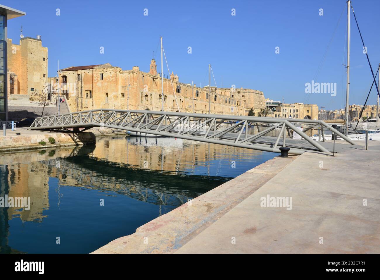 Lattice framed bridge in front of a an old harbour at Bormla in Malta ...