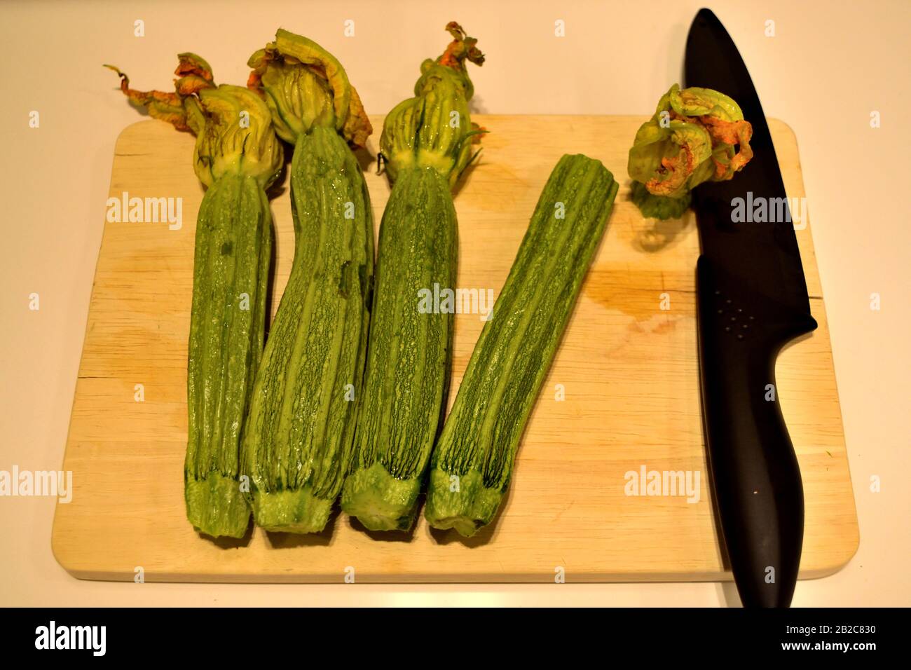 A close up of a cutting board with Zucchini Florence, the courgette ...