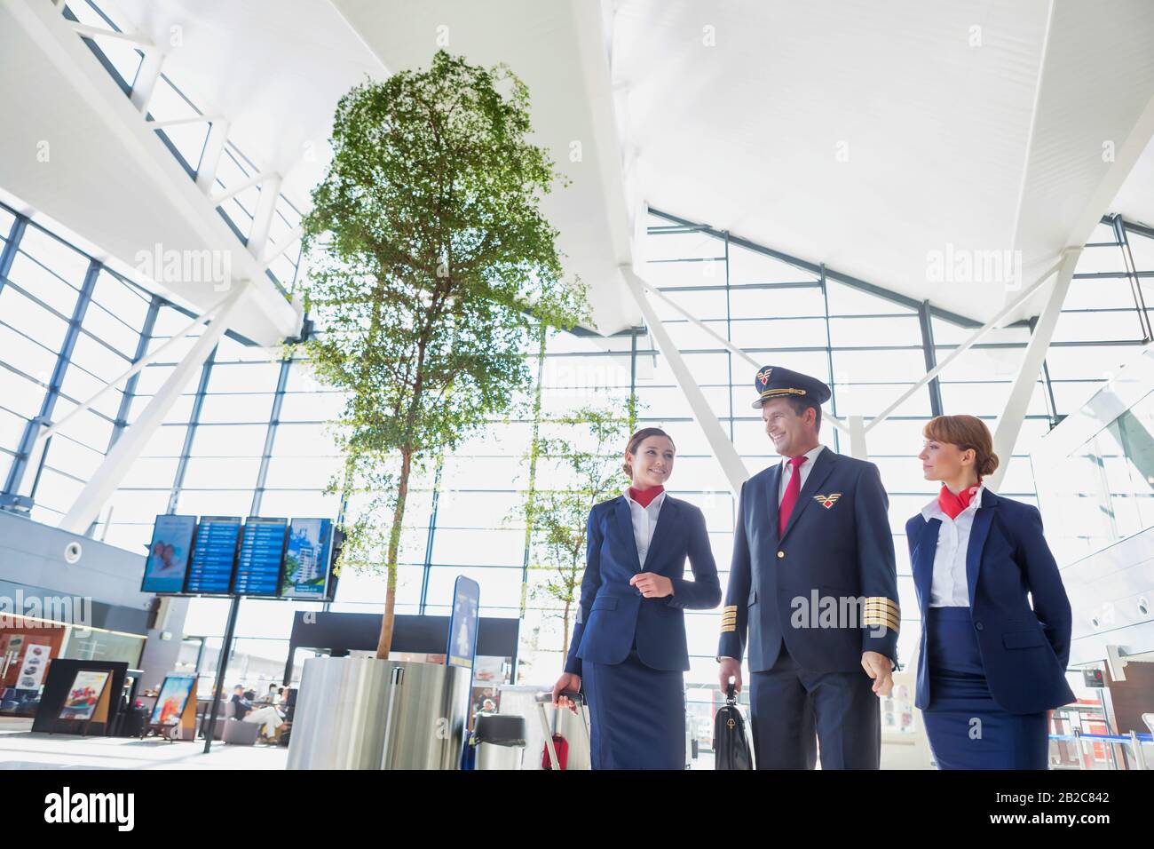 Woman airline pilot walking hi-res stock photography and images - Alamy