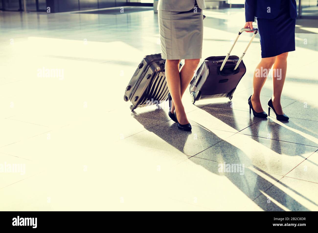 Business people walking with their suitcase in airport Stock Photo - Alamy