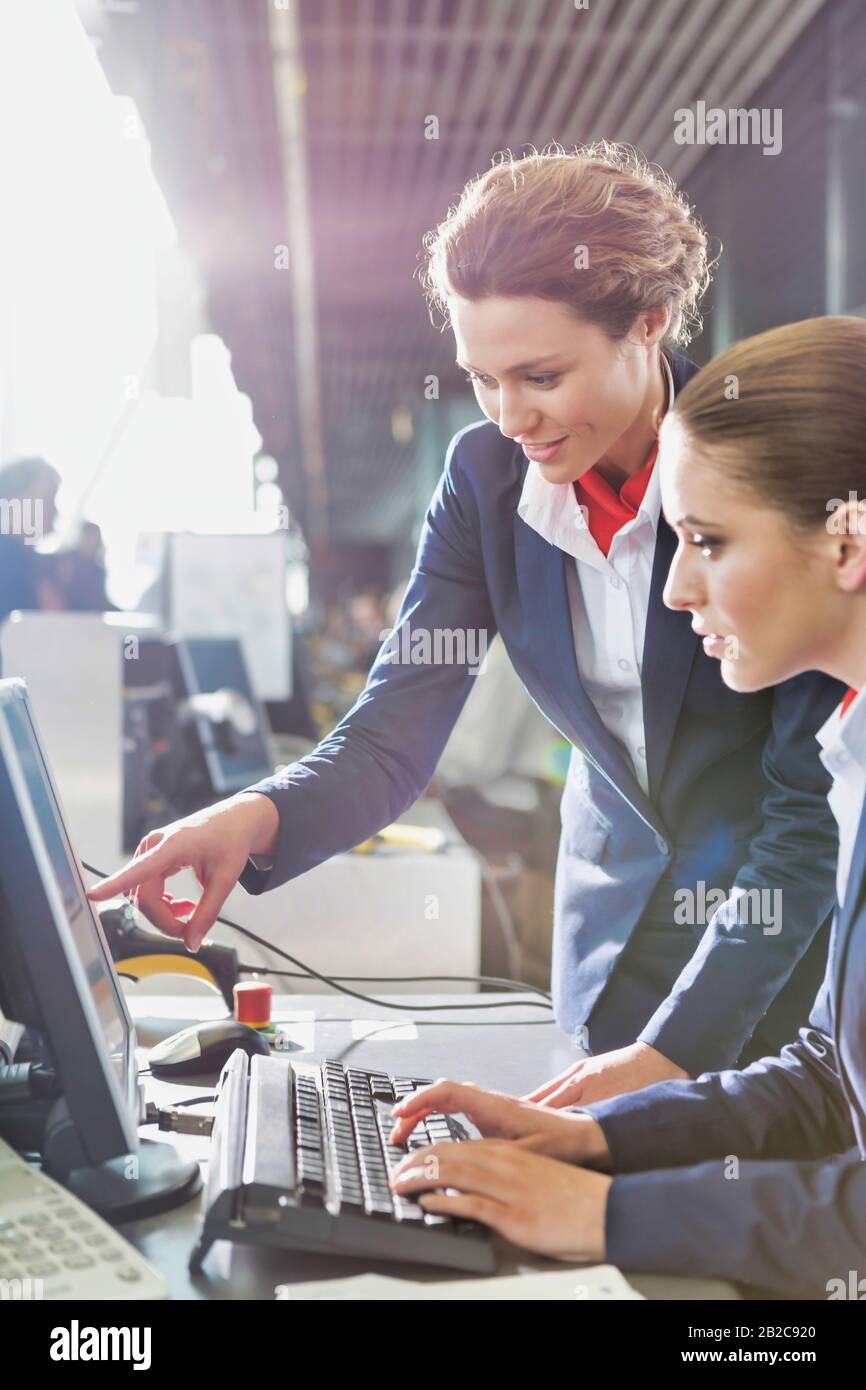Portrait of young attractive passenger service agents working in ...