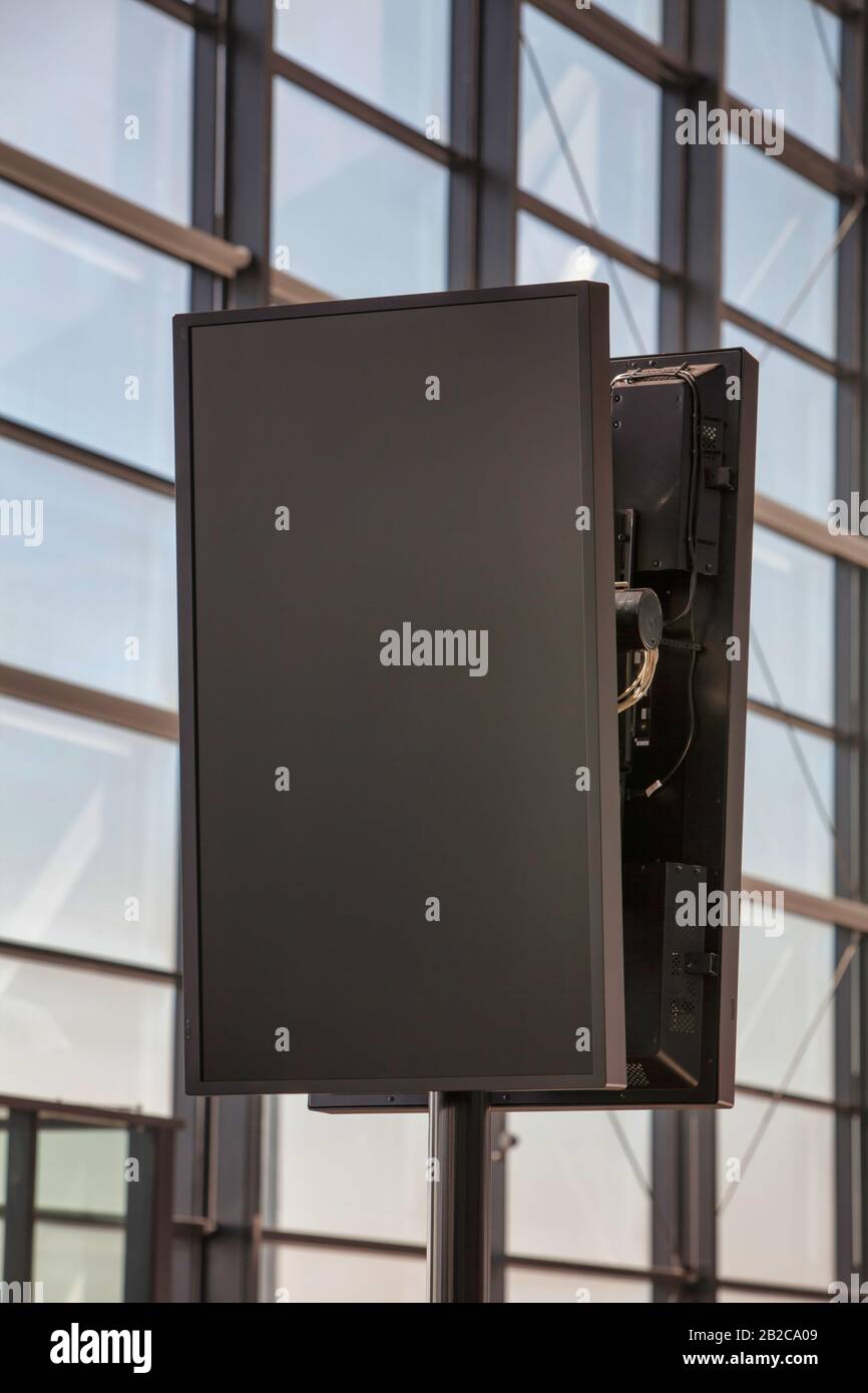 Flight display monitor in airport Stock Photo - Alamy