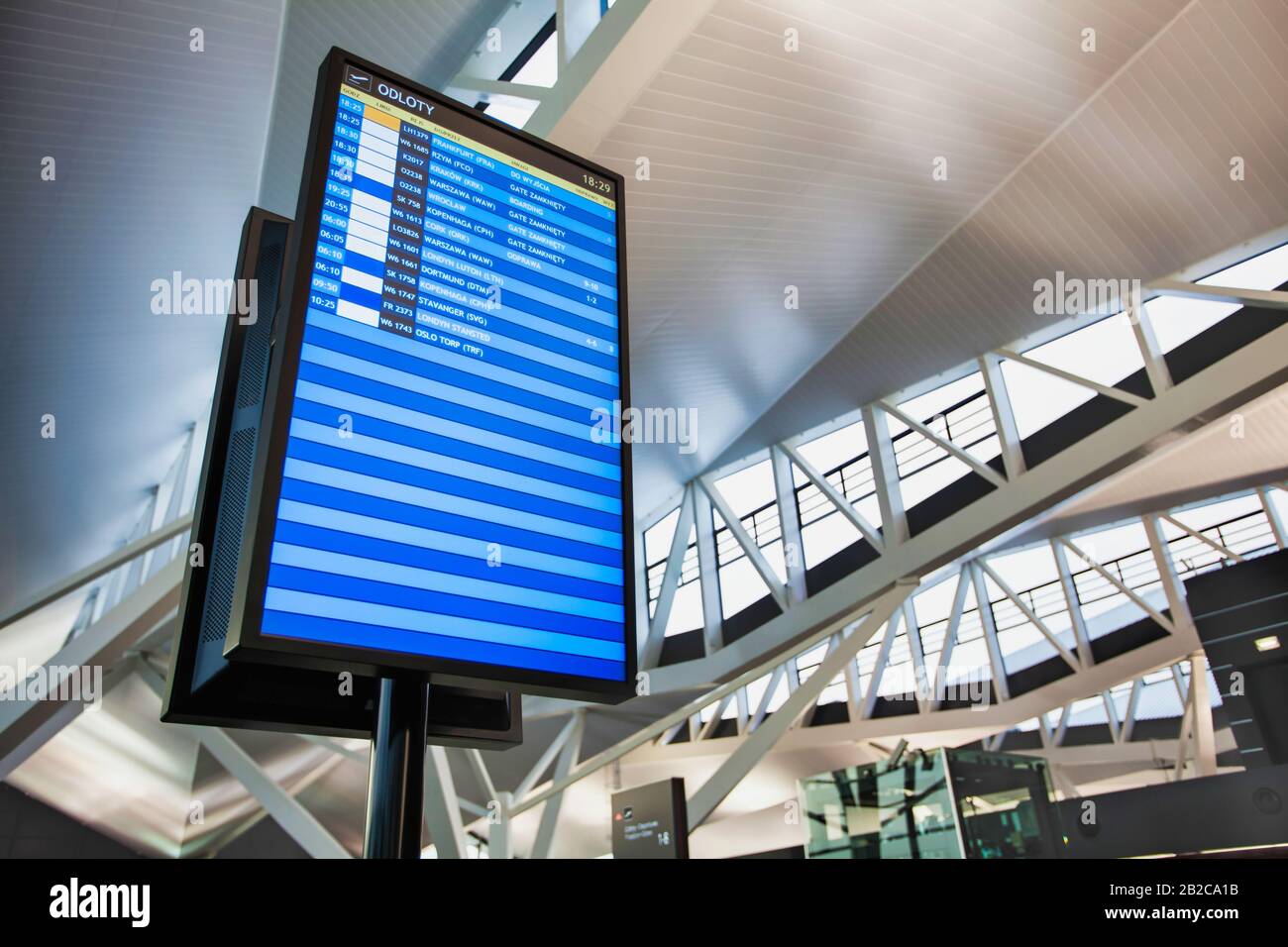 Flight display monitor in airport Stock Photo - Alamy