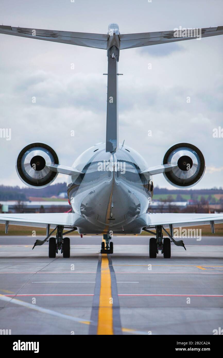Rear view of airplane in airport Stock Photo - Alamy