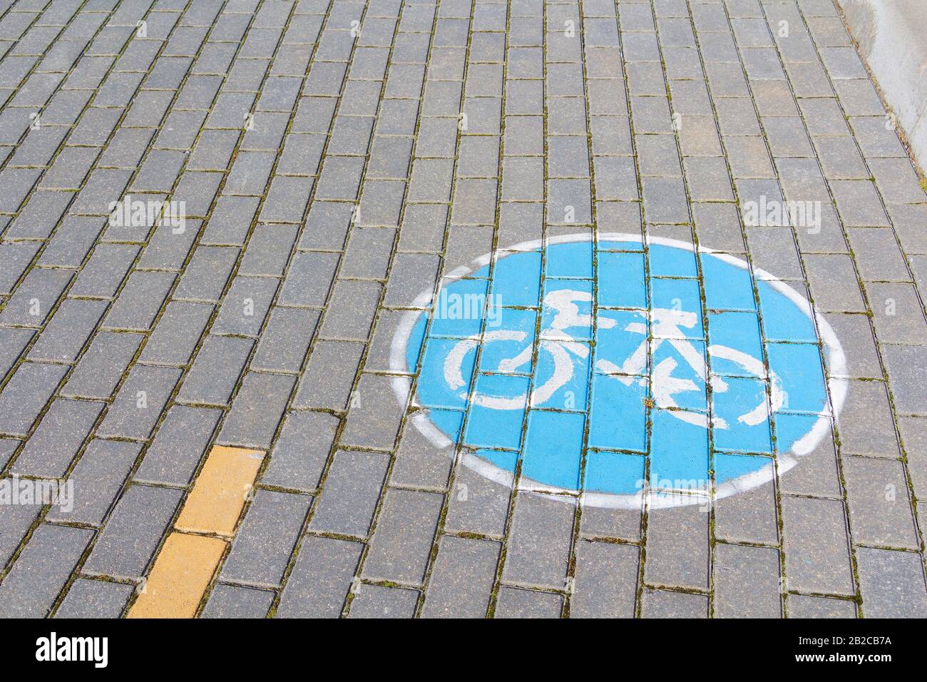 bike path and bike path sign on sidewalk tile Stock Photo - Alamy