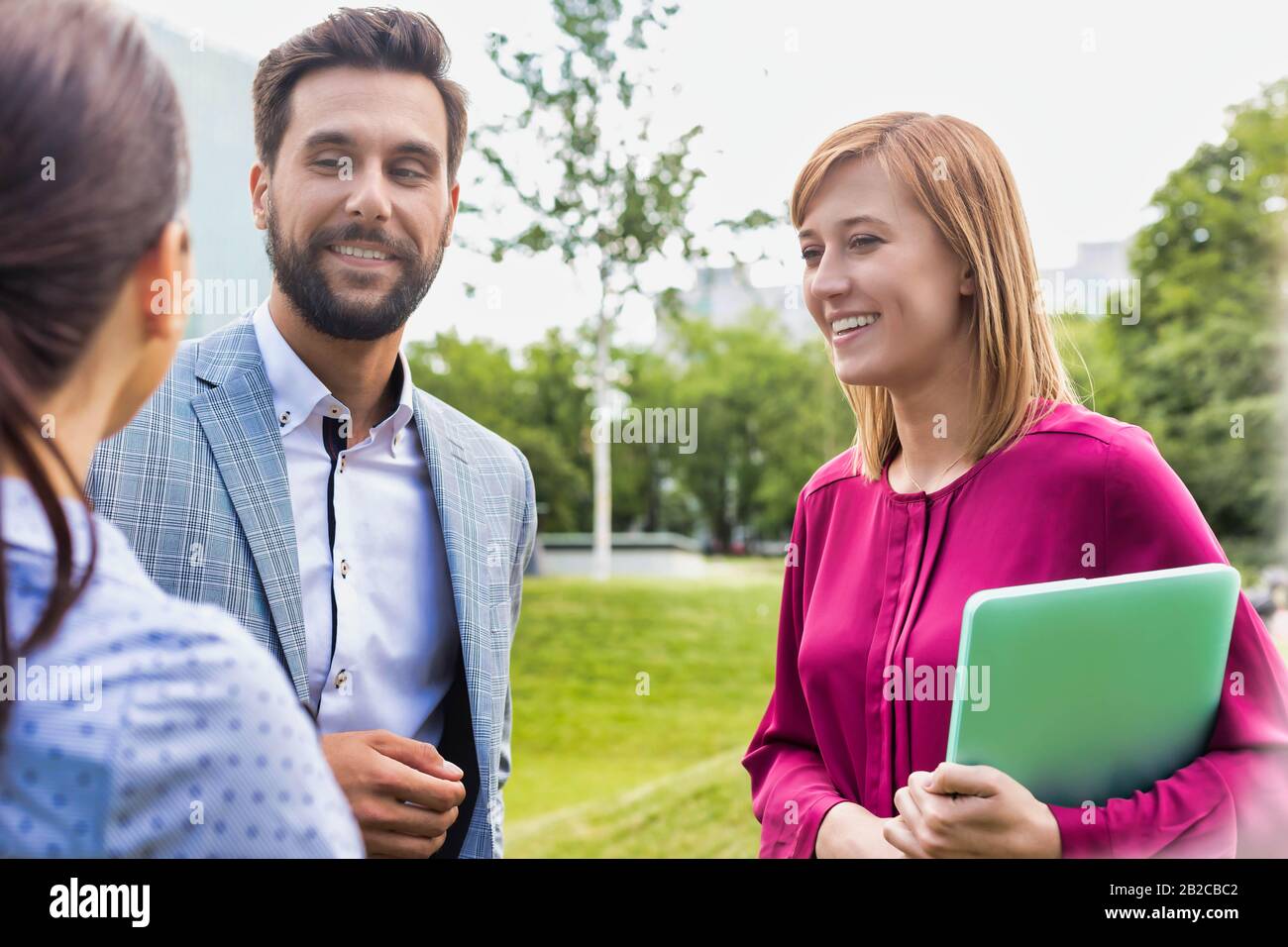 Business people discussing plans on meeting outdoor Stock Photo - Alamy