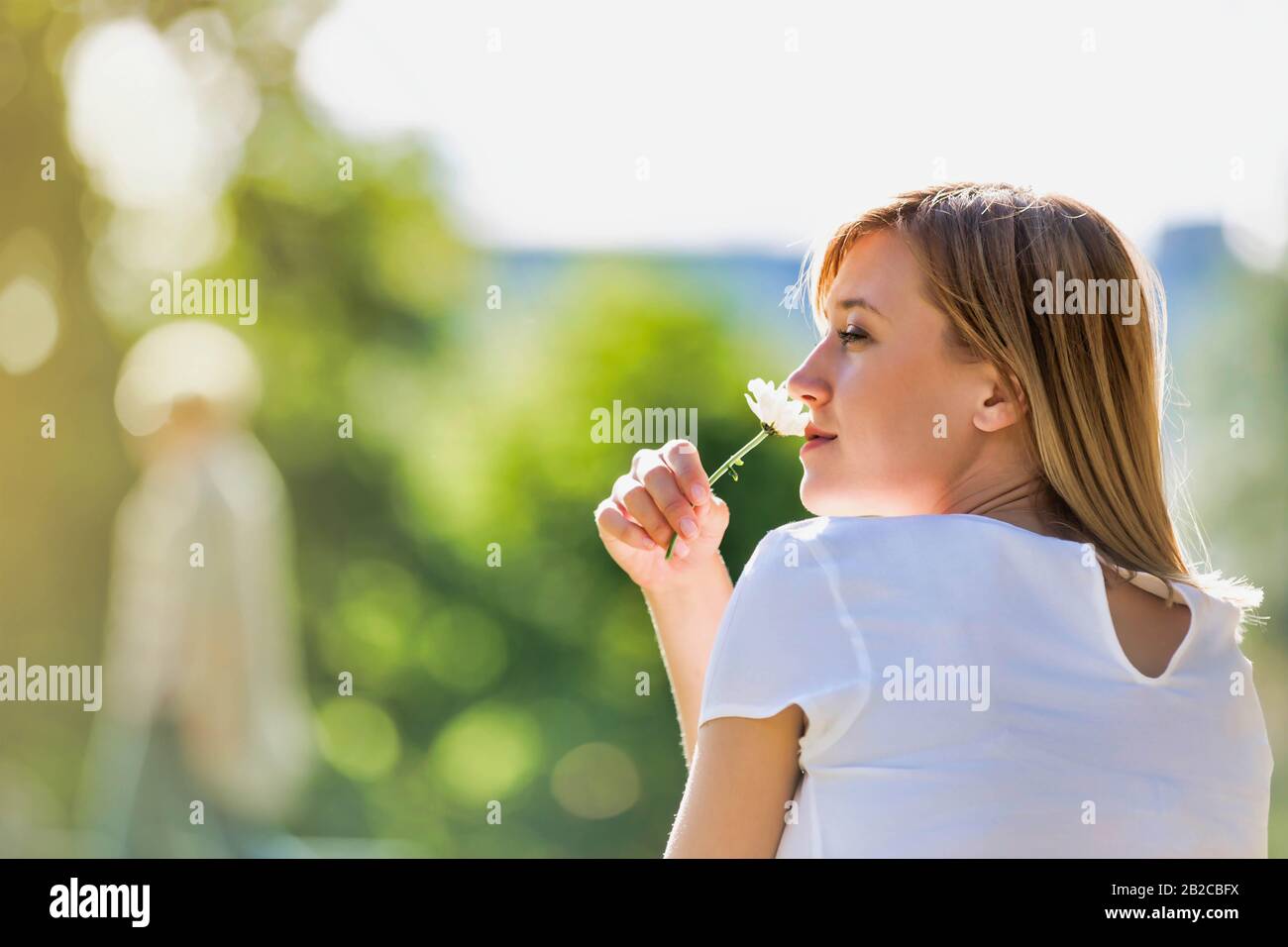Adult smelling grass hi-res stock photography and images - Alamy