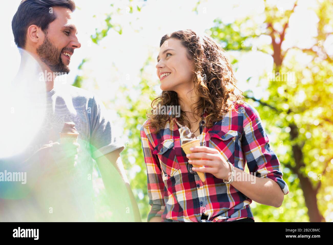 Man and woman walking eating ice cream hi-res stock photography and ...