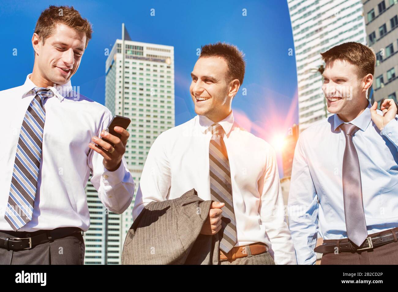 Group of colleagues walking while talking after work Stock Photo - Alamy