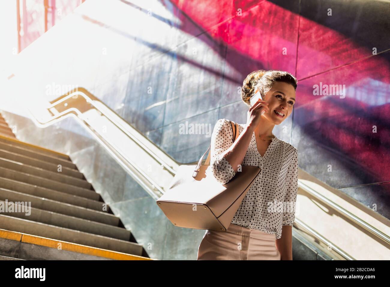 Women walking downstairs hi-res stock photography and images - Alamy