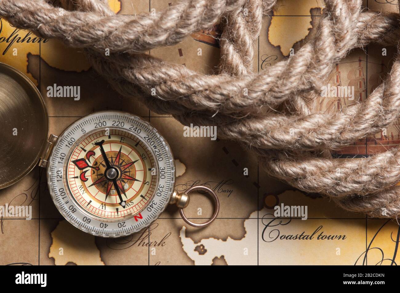compass and rope on a map Stock Photo - Alamy