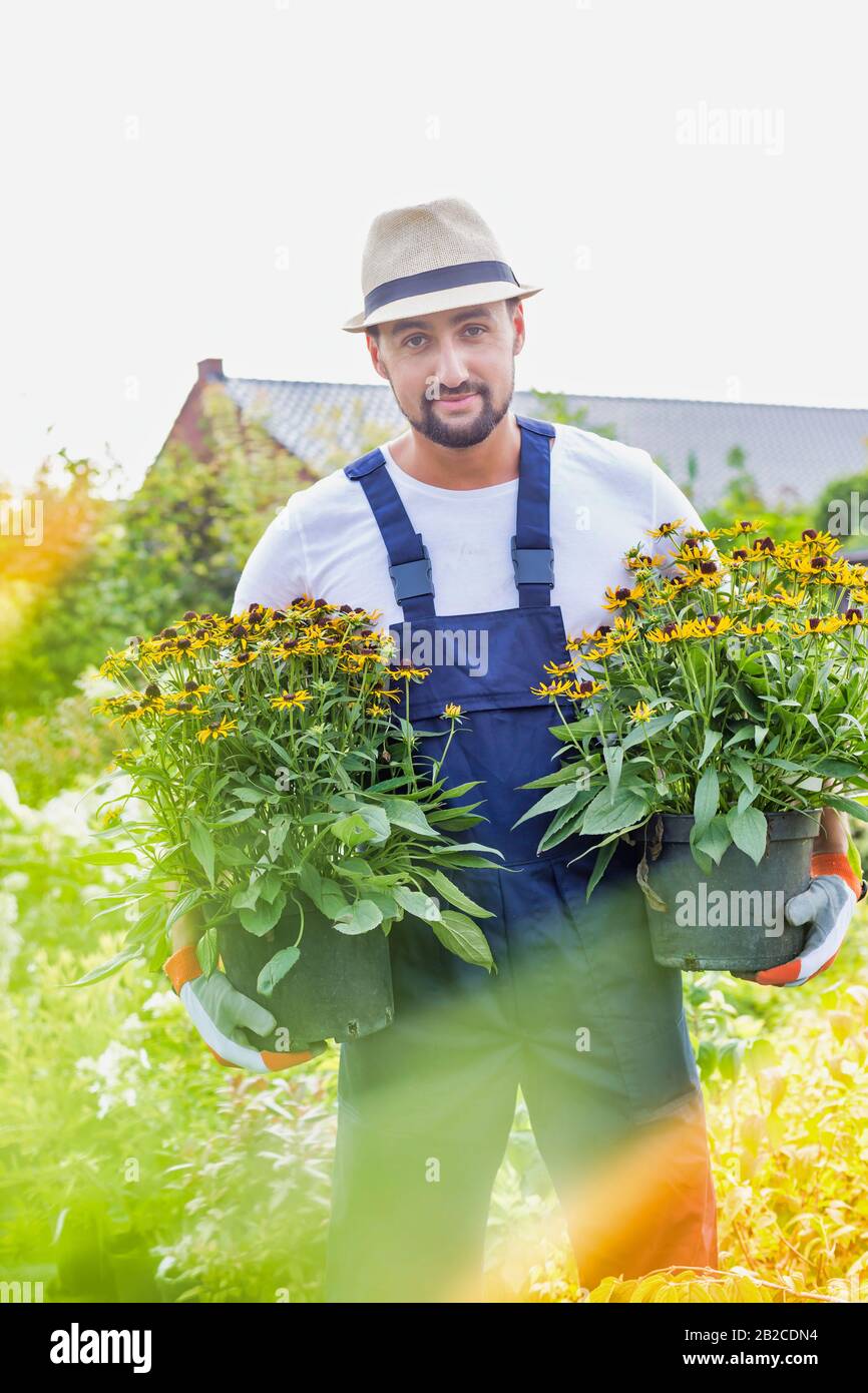 Mature gardener in hat hi-res stock photography and images - Alamy