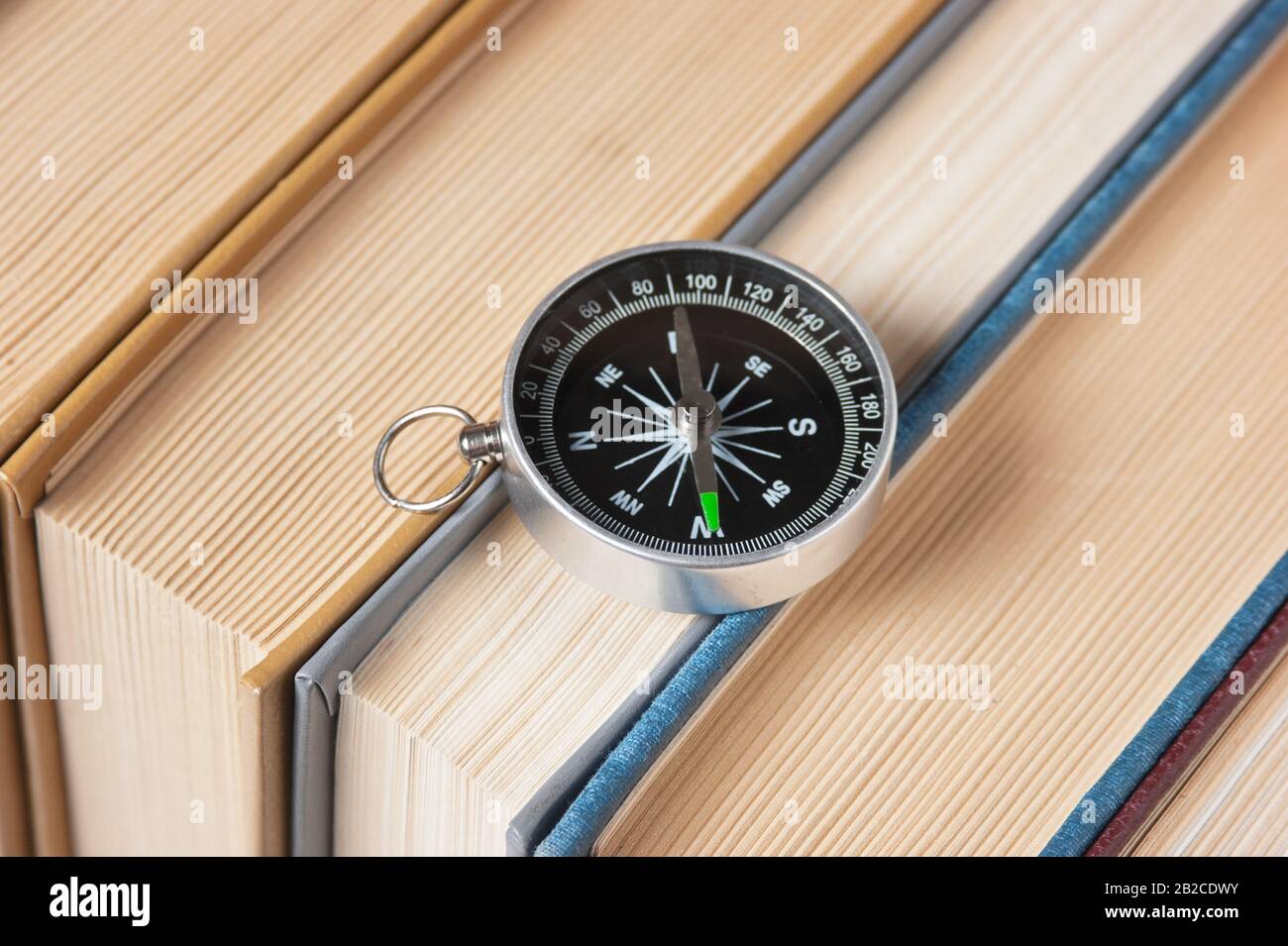 compass and the old books Stock Photo - Alamy